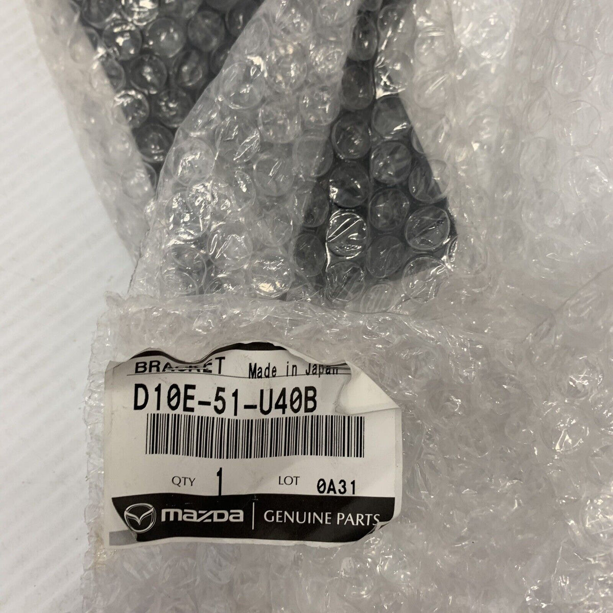 Genuine mazda Wheel Arch Molding Bracket (Left) d10e51u40b – Genuine ...